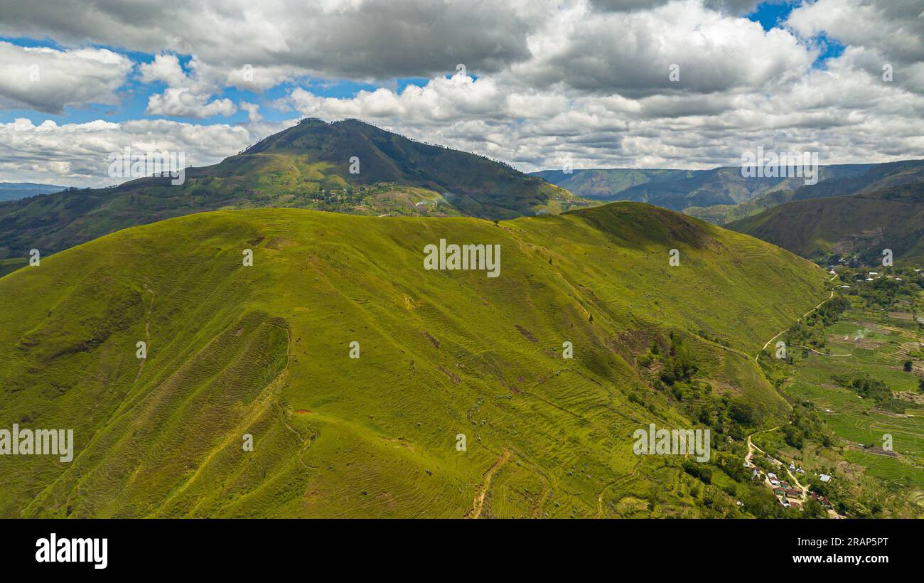 Aerial drone of mountains and hills with forest in the tropics ...