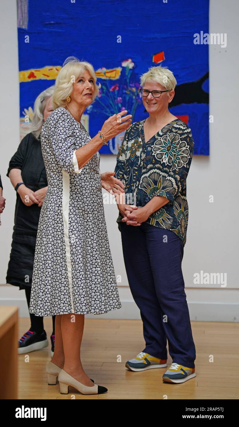 Queen Camilla (left) visits Dovecot studios in Edinburgh, to meet ...
