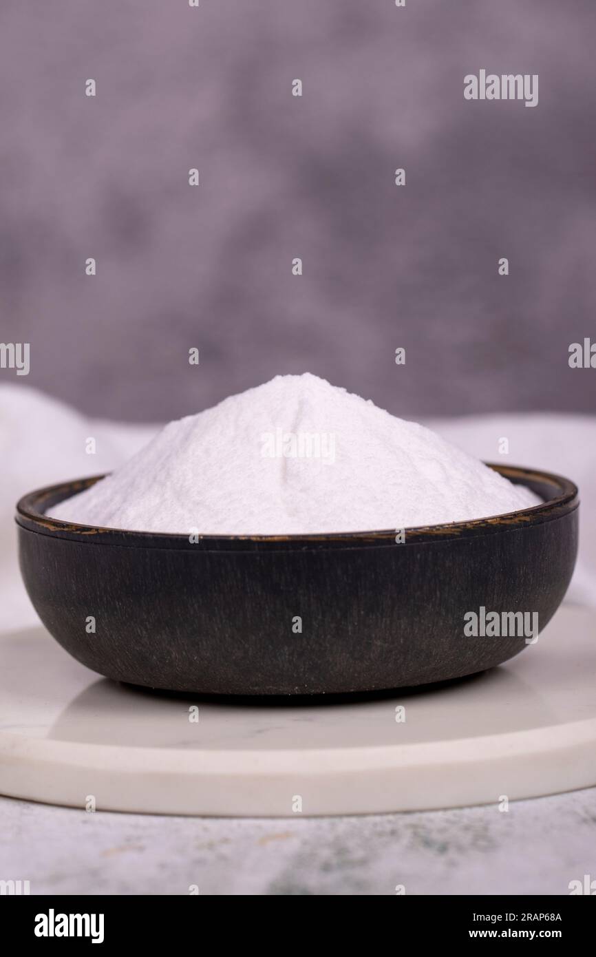 Sodium bicarbonate or baking soda on grey background. Sodium ...