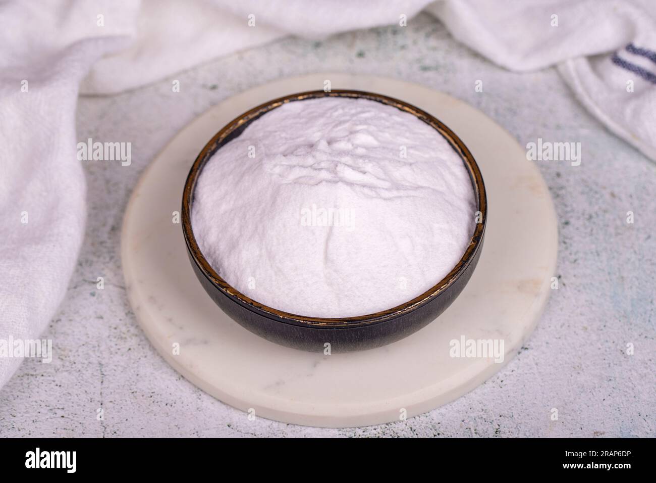 Sodium bicarbonate or baking soda on grey background. Sodium ...