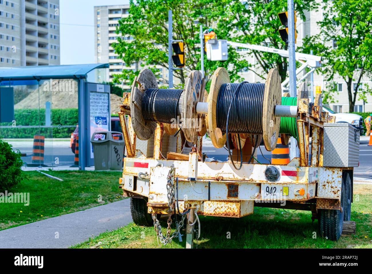 Wheeled cart with rolls of cable for communication installations in a ...