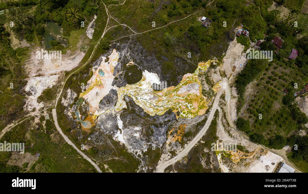 Aerial view of geothermal hot springs covered with sulfur and volcanic ...