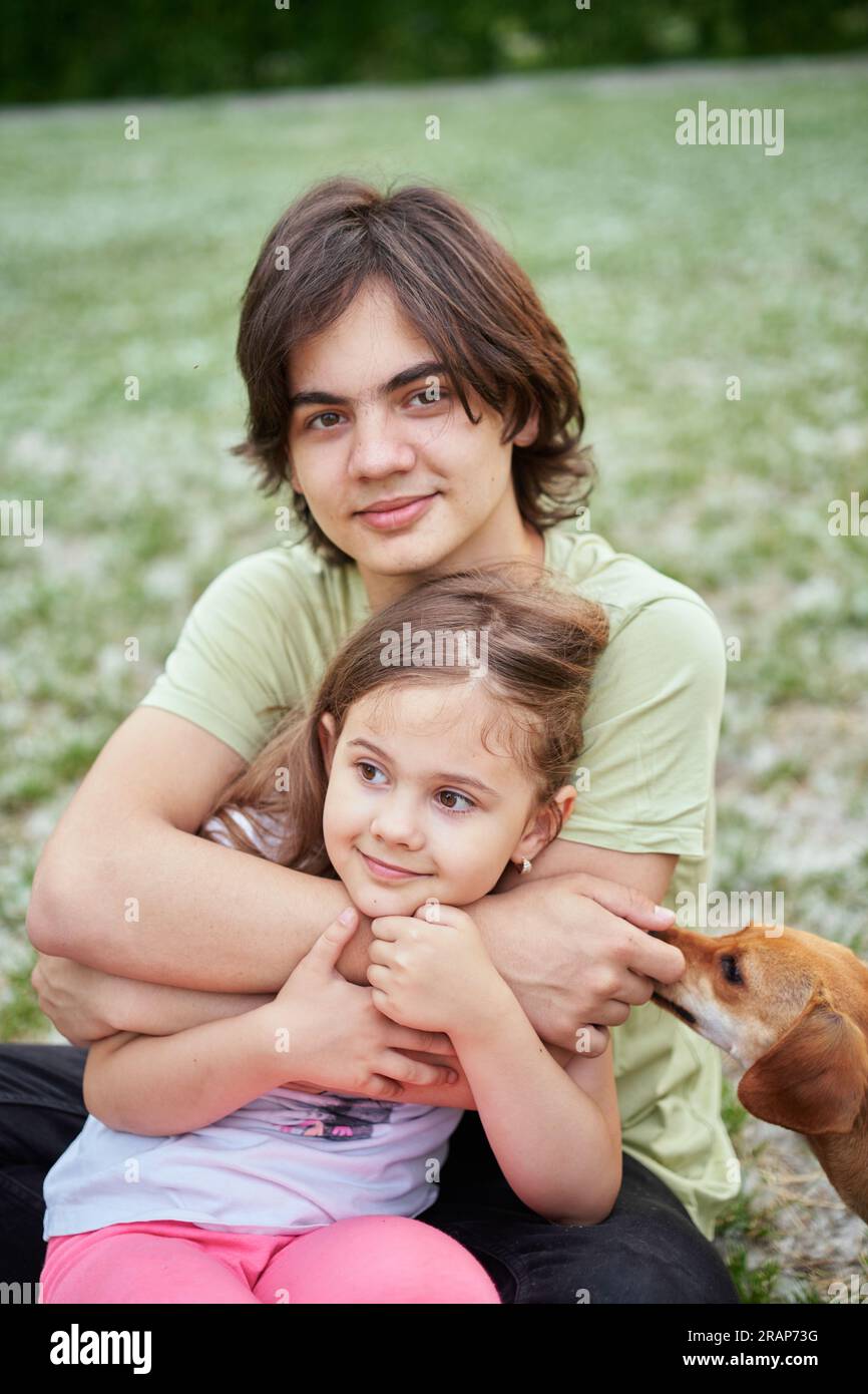 Brotherhood, sisterhood, siblings, family concept. Loving cheerful boy ...