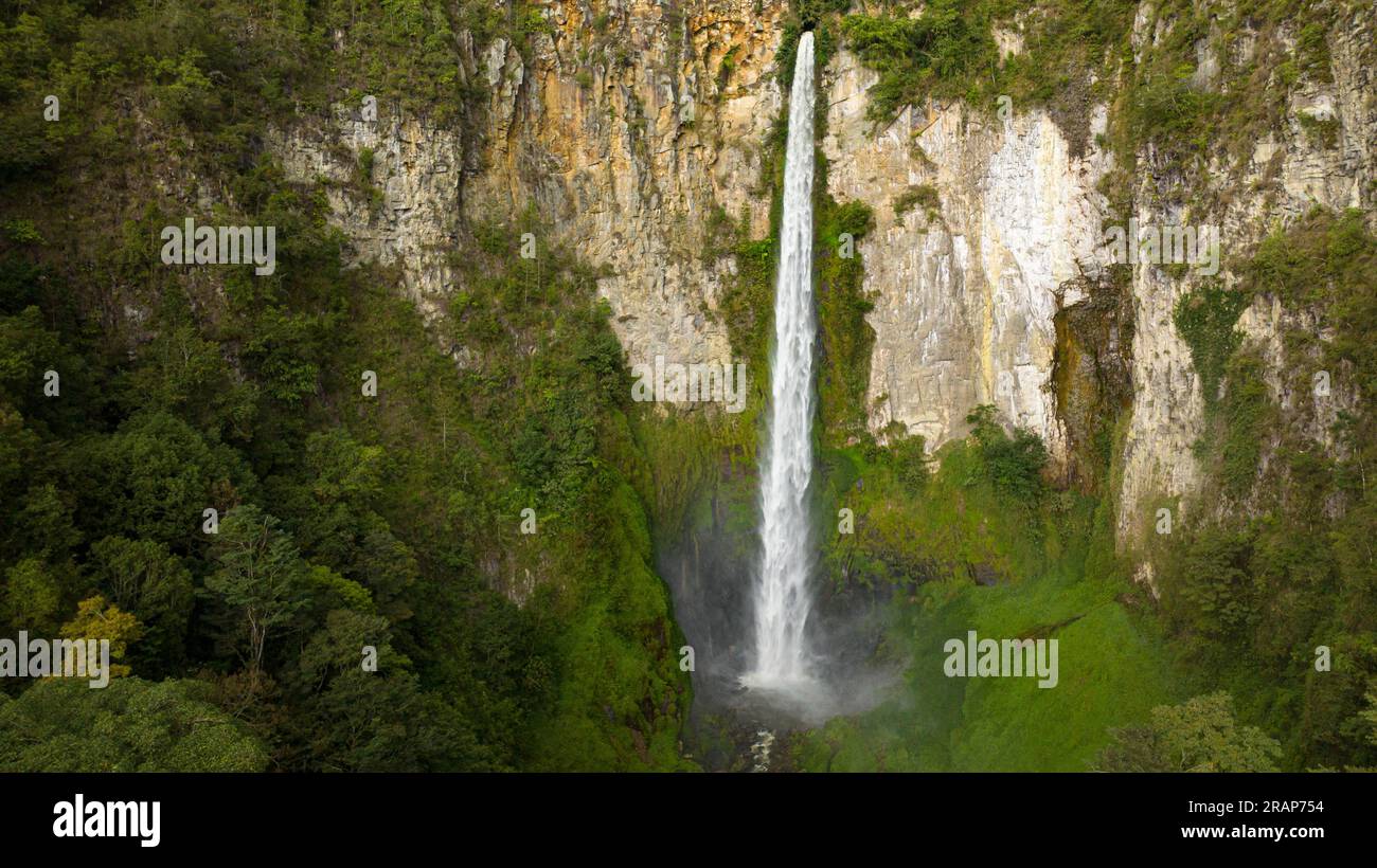 Waterfall in a tropical forest. Sipiso Piso falls. Sumatra, Indonesia ...
