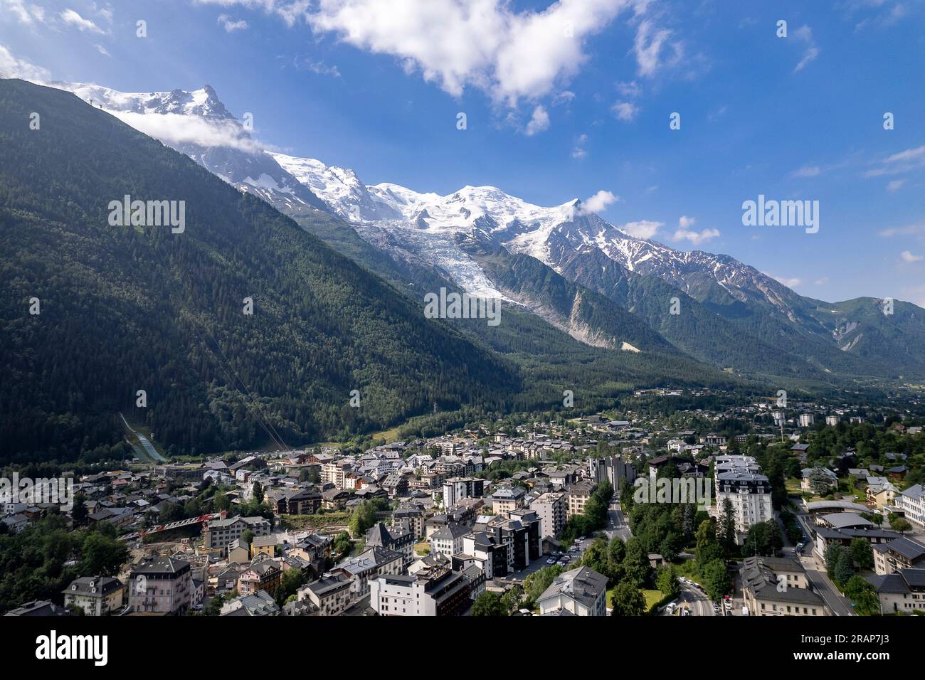Aerial of tourist destination in French Alps Chamonix village with the Mont Blanc massive in the ...