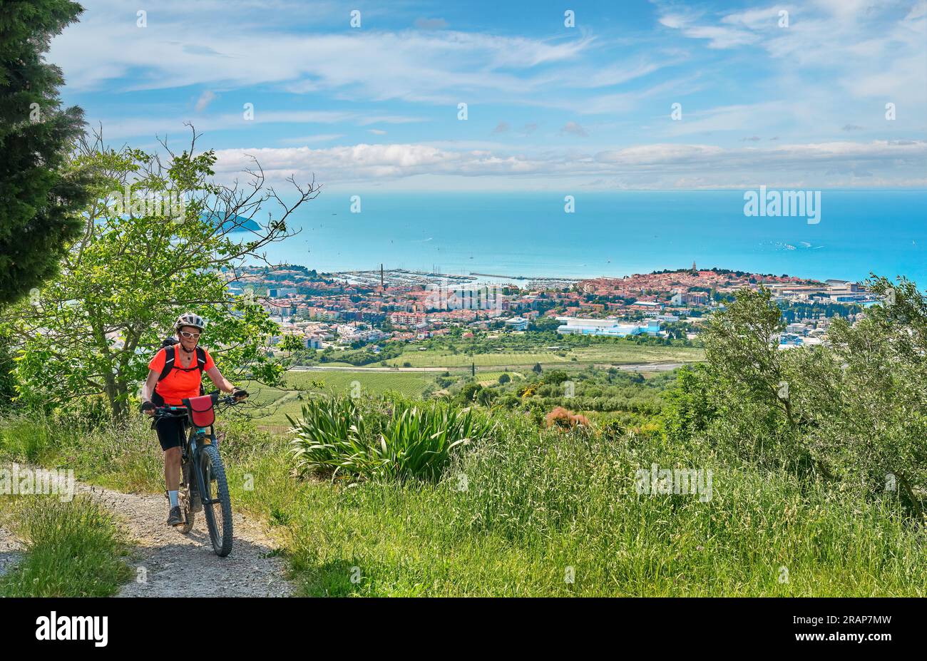 nice active senior woman on a mountain bike tour at the Slovenian ...