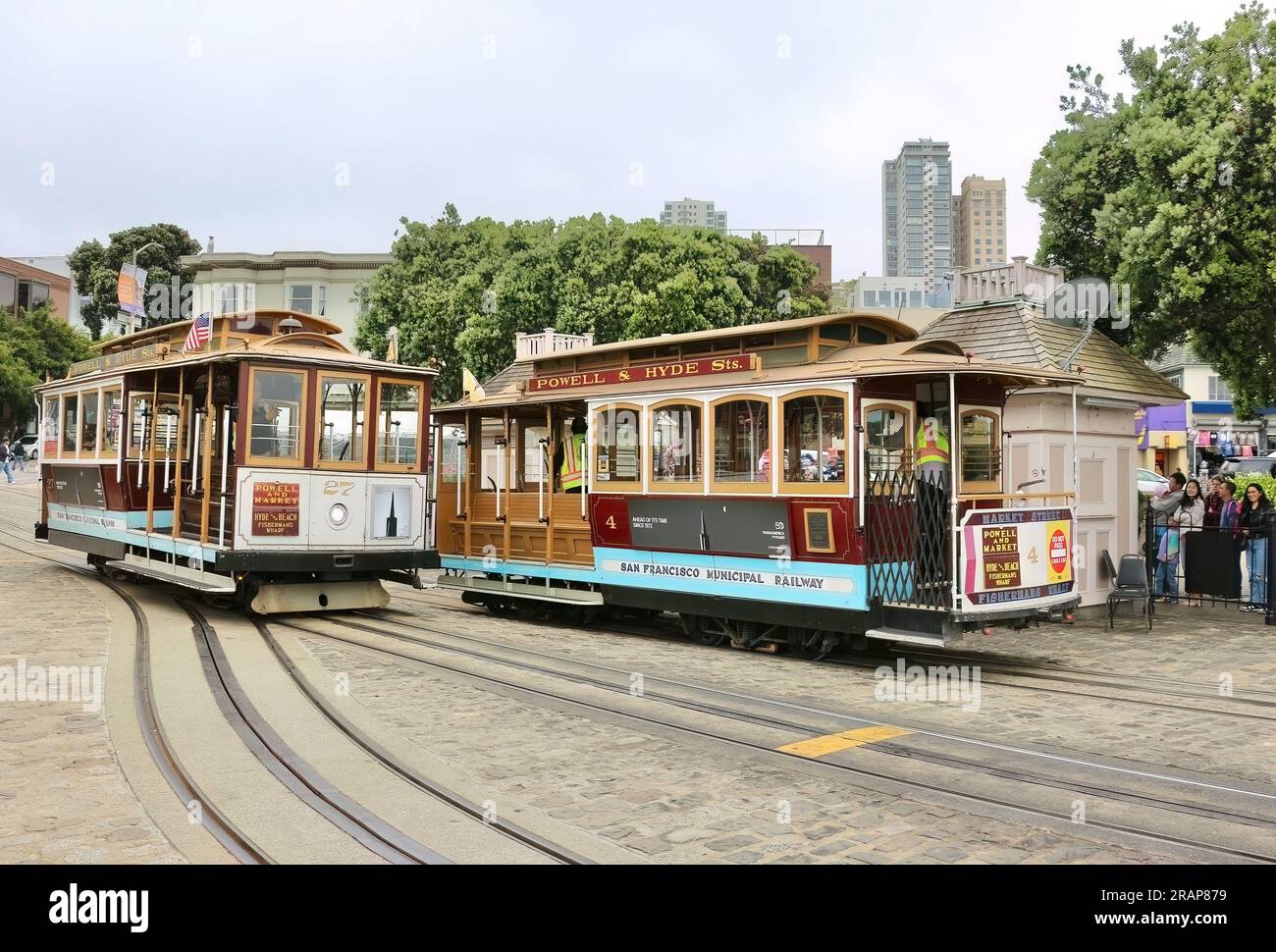 Tourists boarding an antique cable car at the Powell/Hyde Cable Car ...