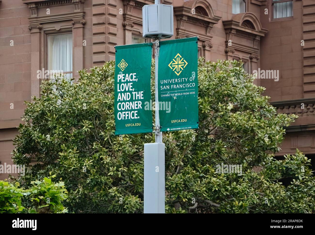 One of the many banners in the streets Peace love and the Corner Office ...