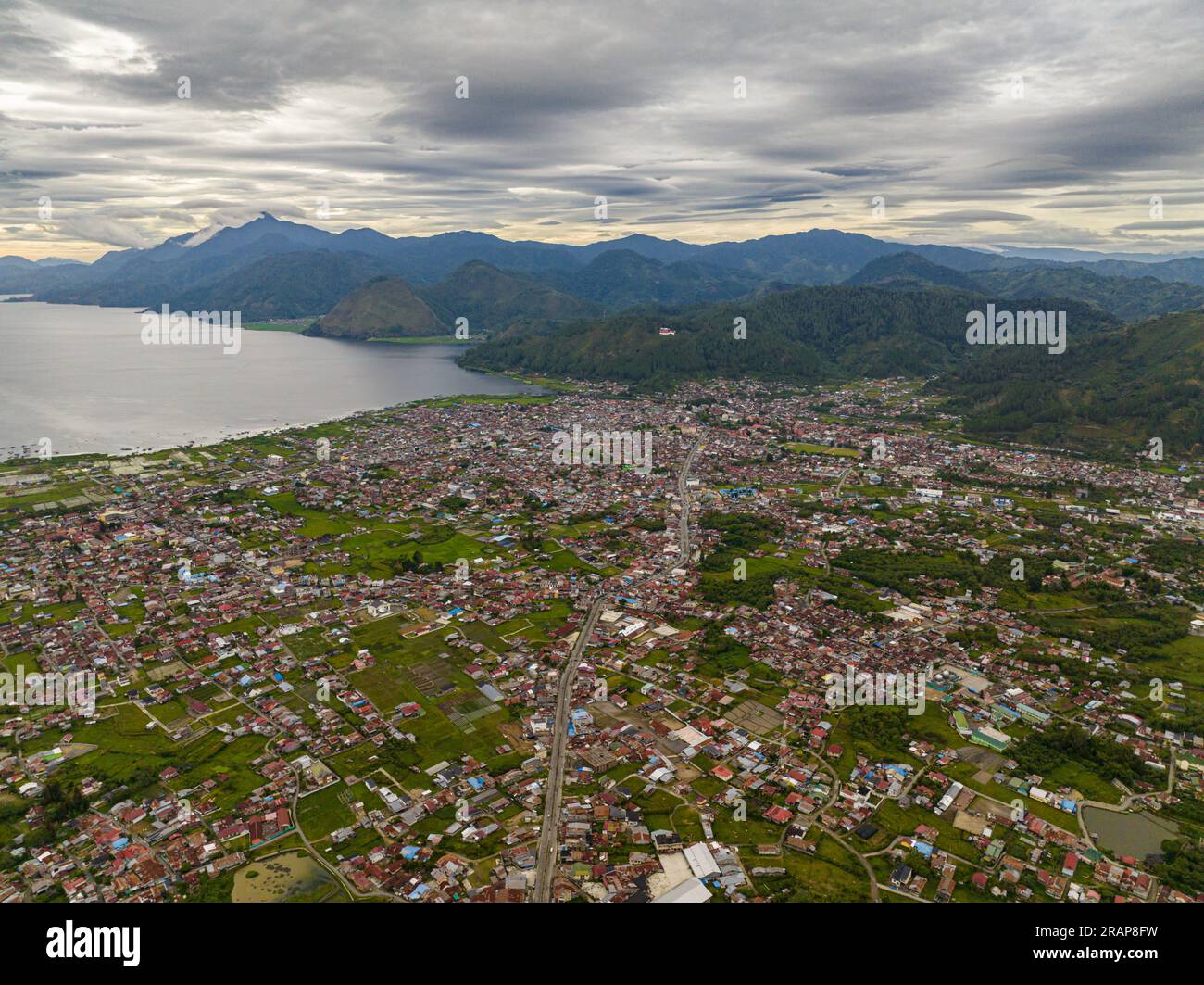 Aerial view of Takengon city in mountains among farmland and Laut tawar ...