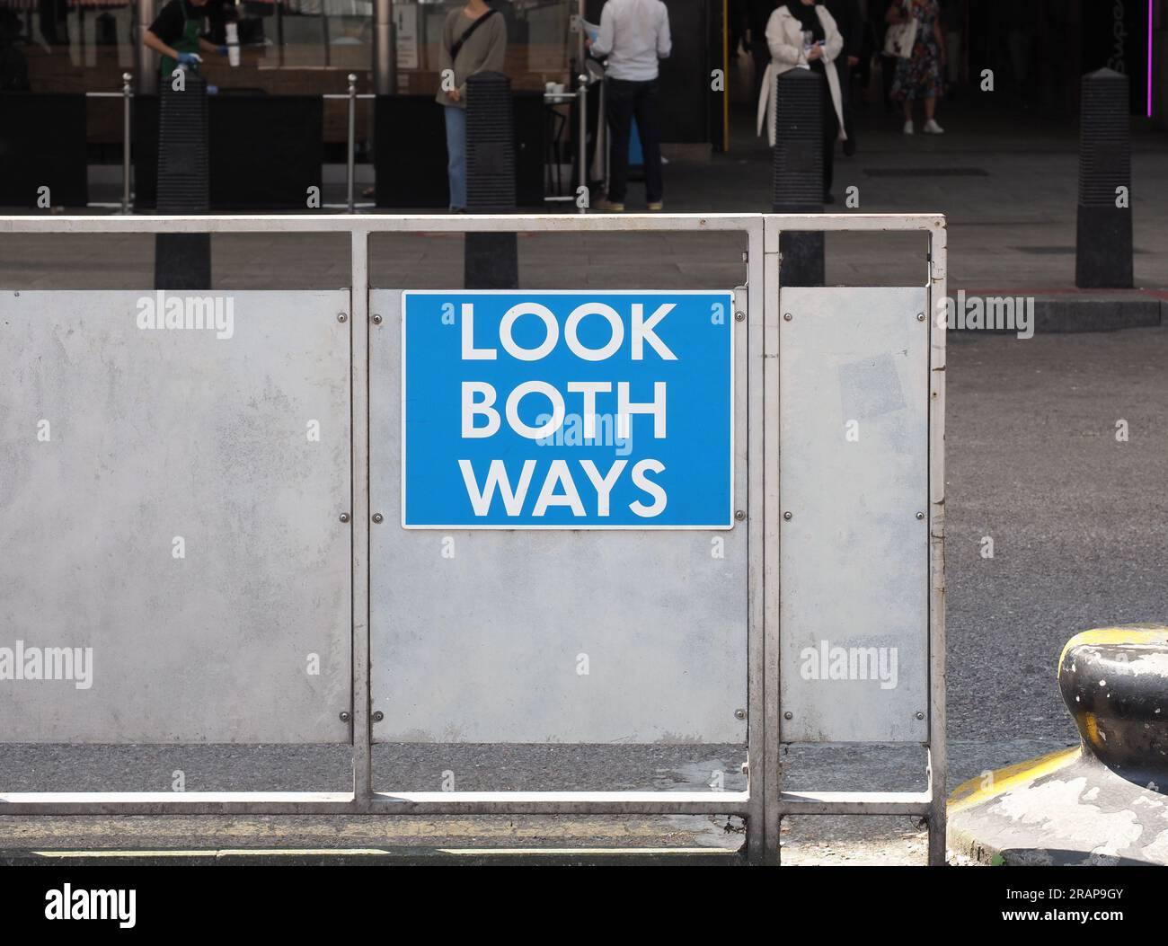 look both ways traffic sign in white over blue Stock Photo - Alamy
