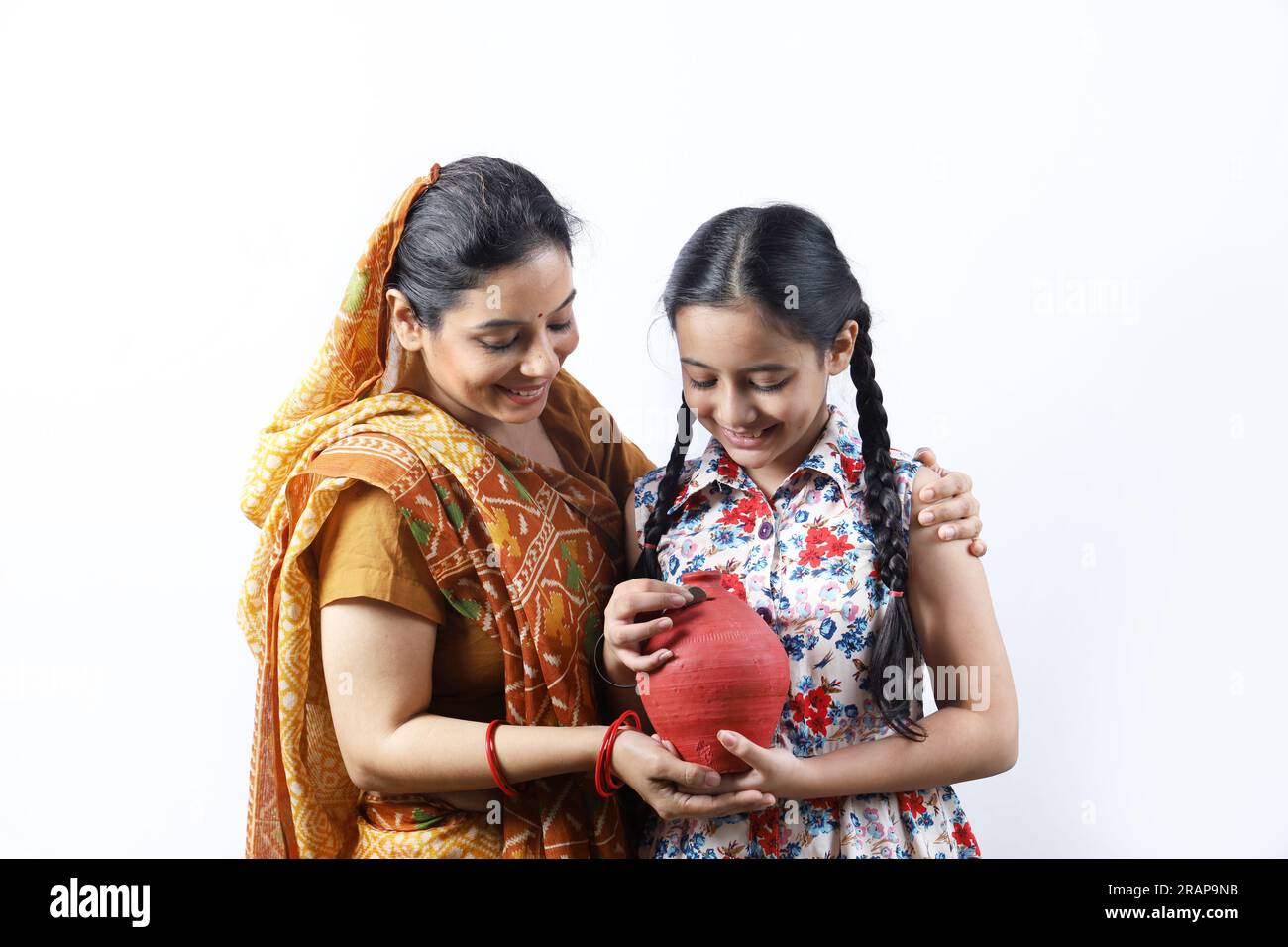 Happy rural Indian villager family of women saving money for future in ...