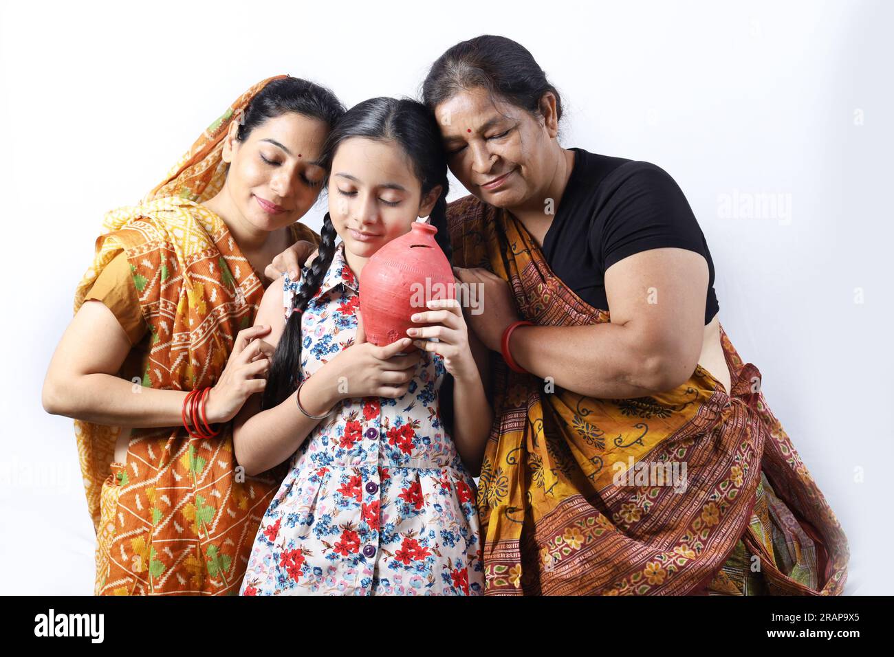 Happy rural Indian villager family of women saving money for future in ...