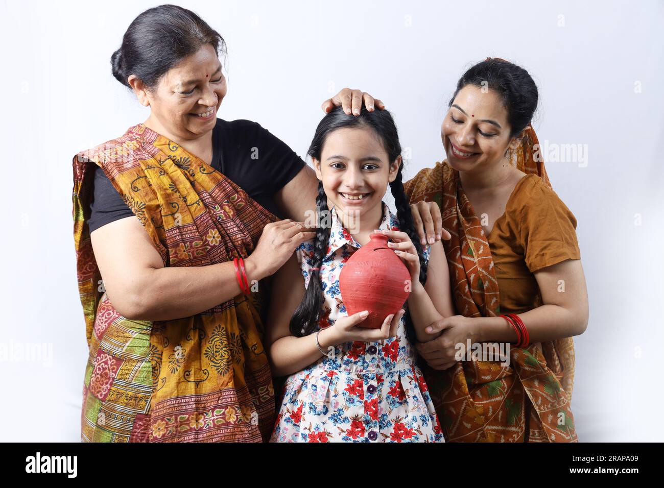 Happy rural Indian villager family of women saving money for future in ...
