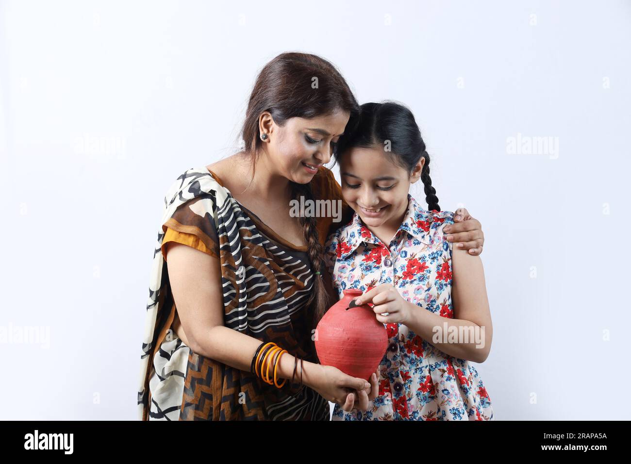 Happy rural Indian villager family of women saving money for future in ...