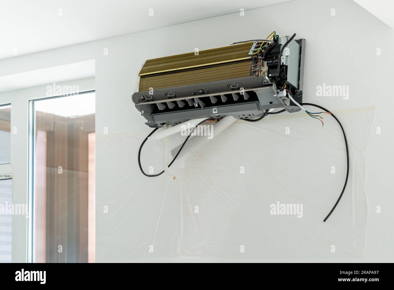 Installation air conditioning system in room with white wall in ...