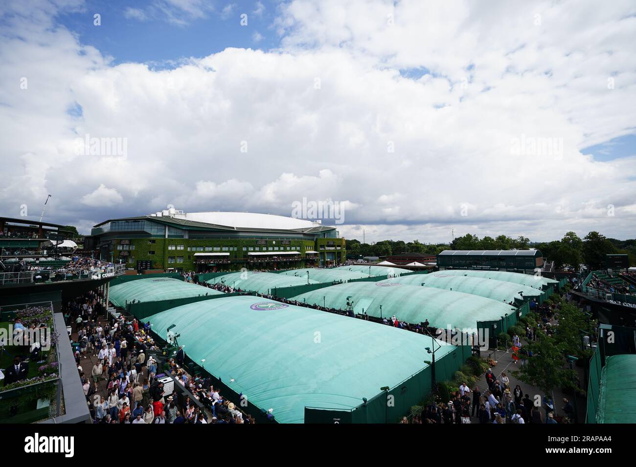 A general view of the outside courts as rain delays the start of play ...
