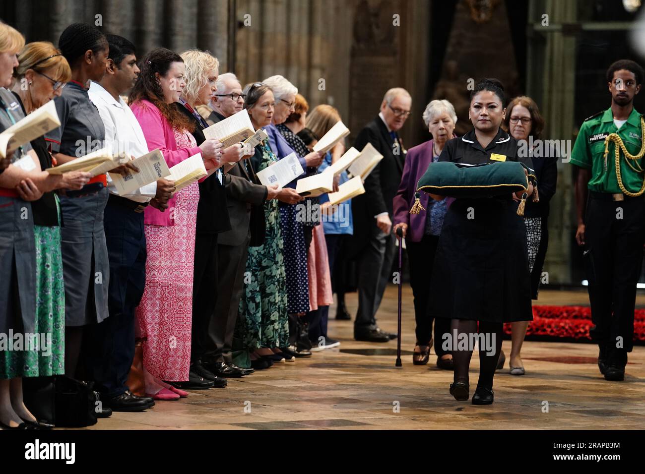 Nurse May Parsons in the procession at the start of the service ...