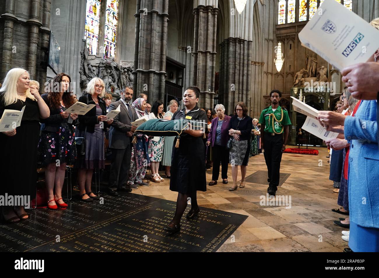 Nurse May Parsons in the procession at the start of the service ...