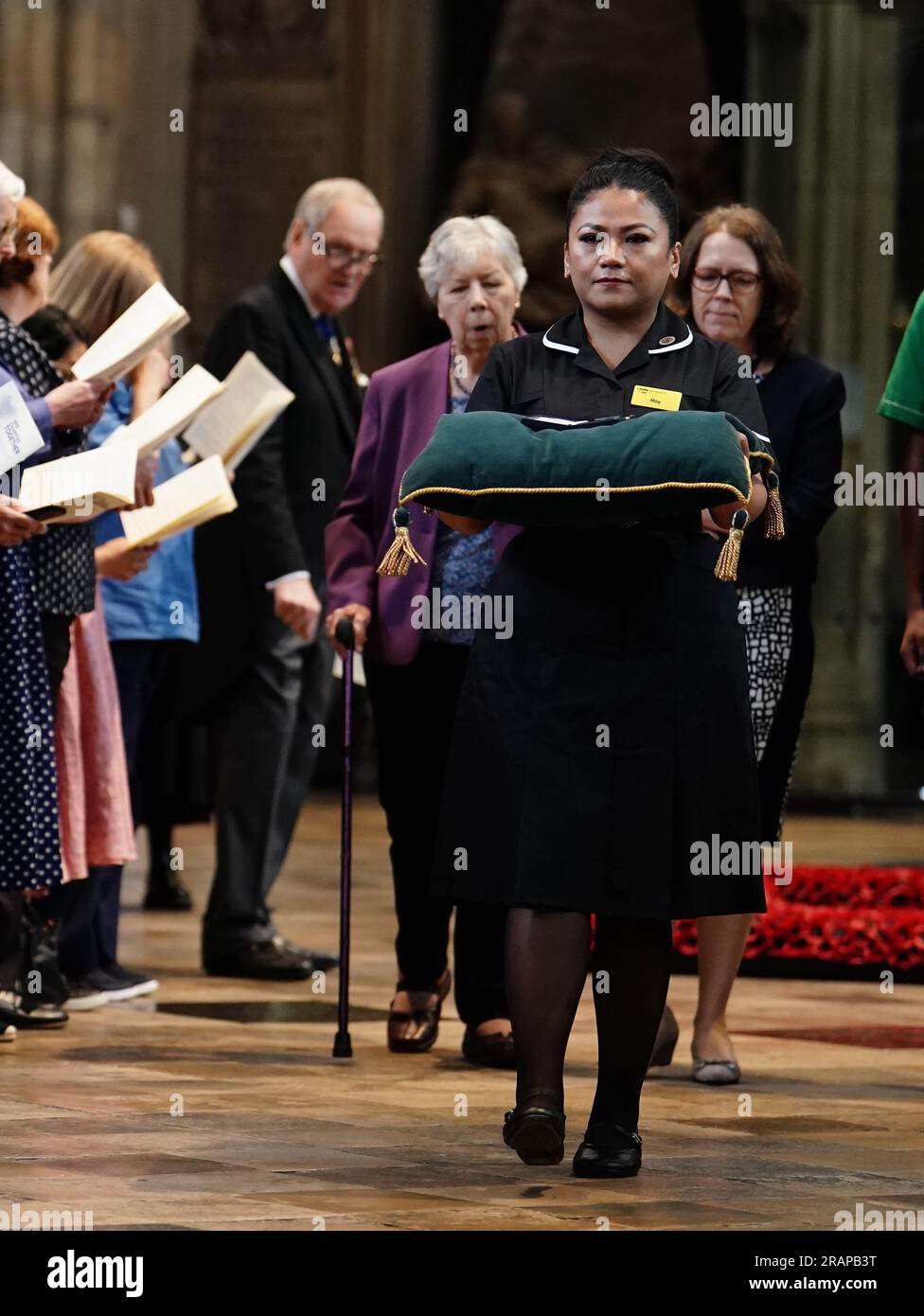 Nurse May Parsons in the procession at the start of the service ...