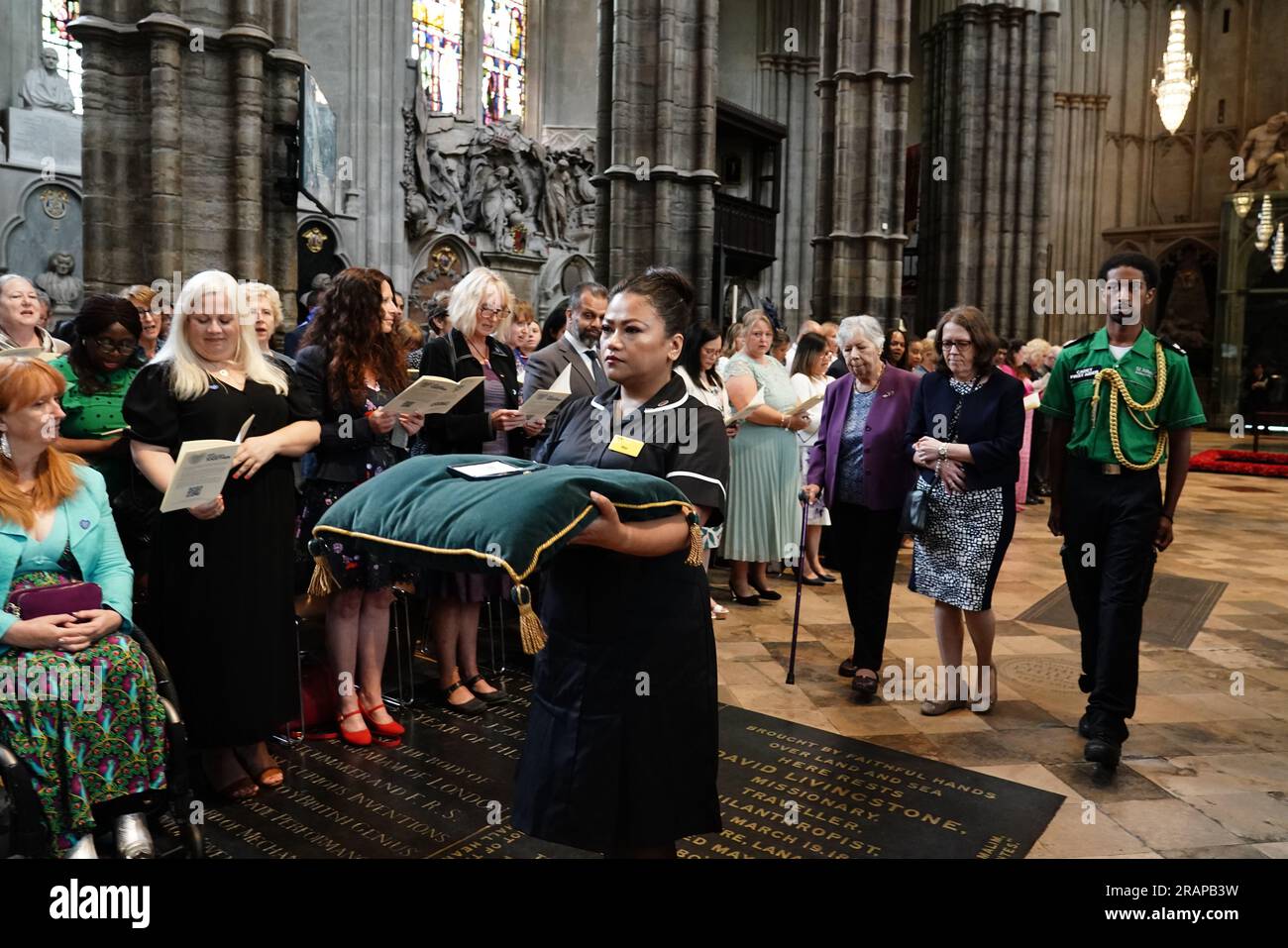 Nurse May Parsons in the procession at the start of the service ...