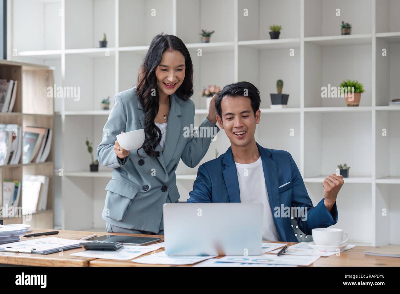 Business strategy success. Overjoyed colleagues emotionally celebrating ...