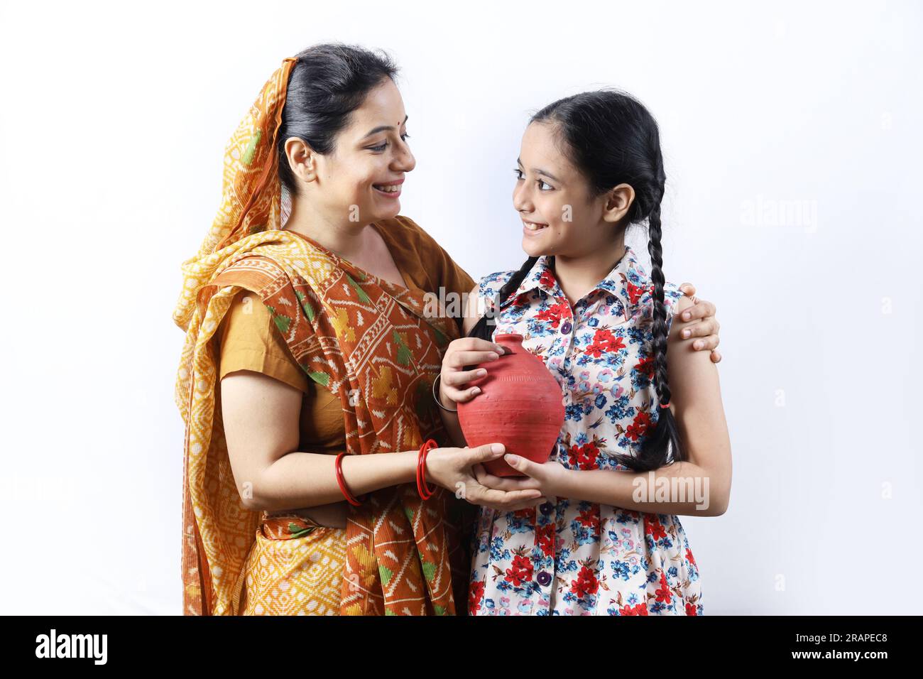 Happy rural Indian villager family of women saving money for future in ...
