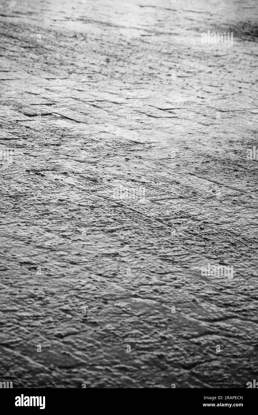 Rainy background with rain water circle splashes on the cobblestone of ...