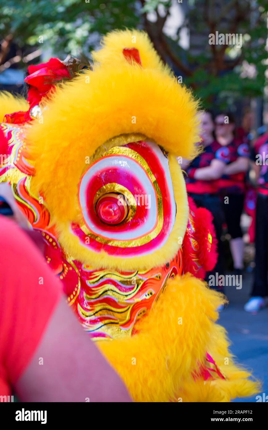 A Chinese Dragon dance moving through a crowd and looking scary during ...