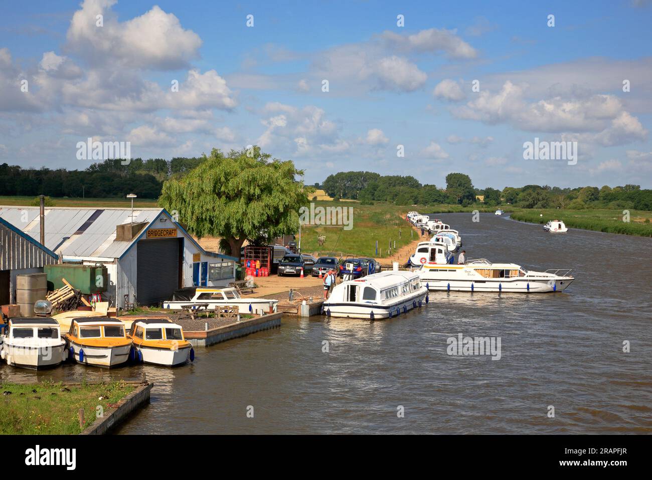 A small boatyard by the River Bure at Acle Bridge on the Norfolk Broads ...