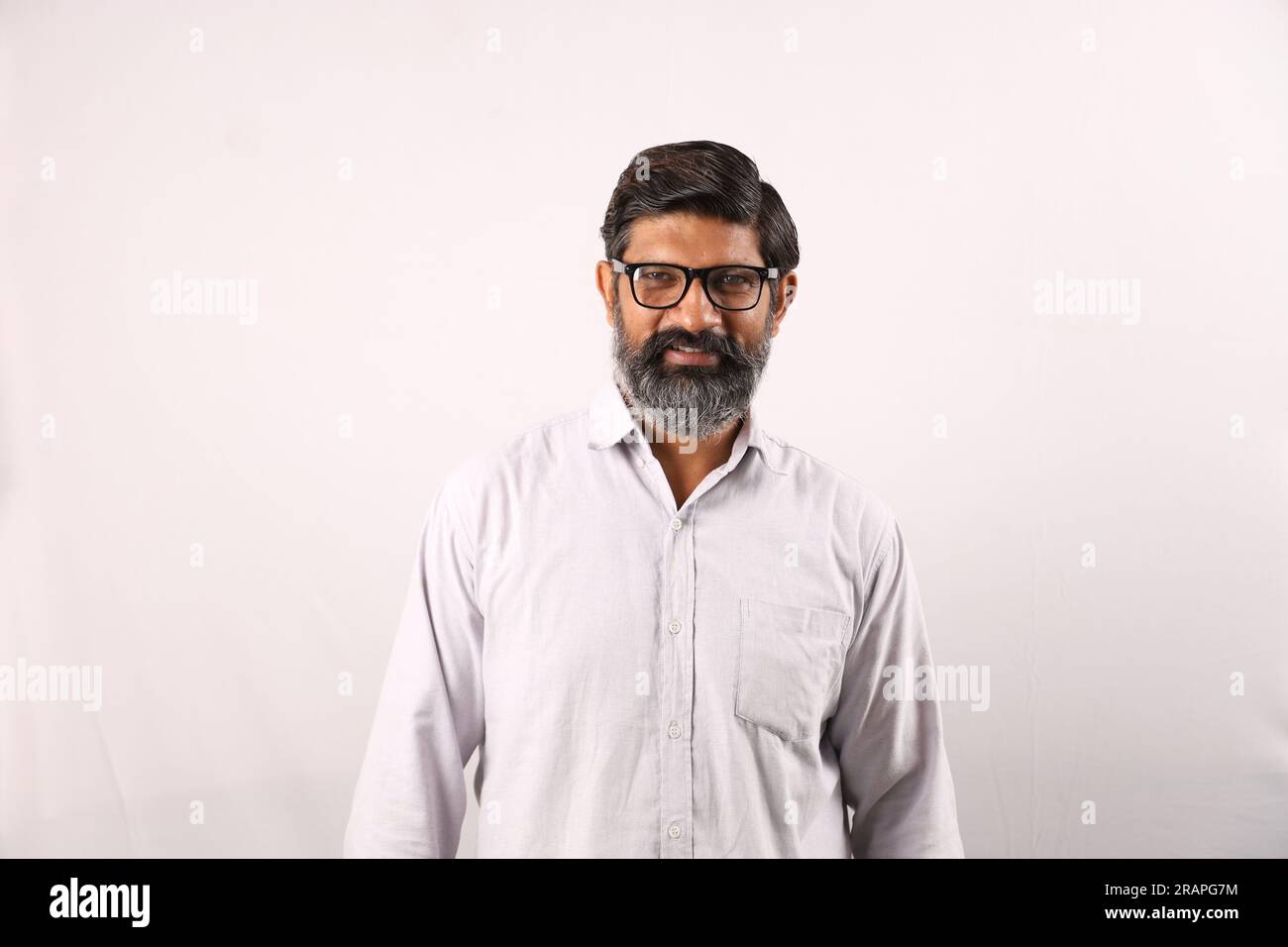 Portrait of an Indian bearded man wearing shirt. Funky expressions ...