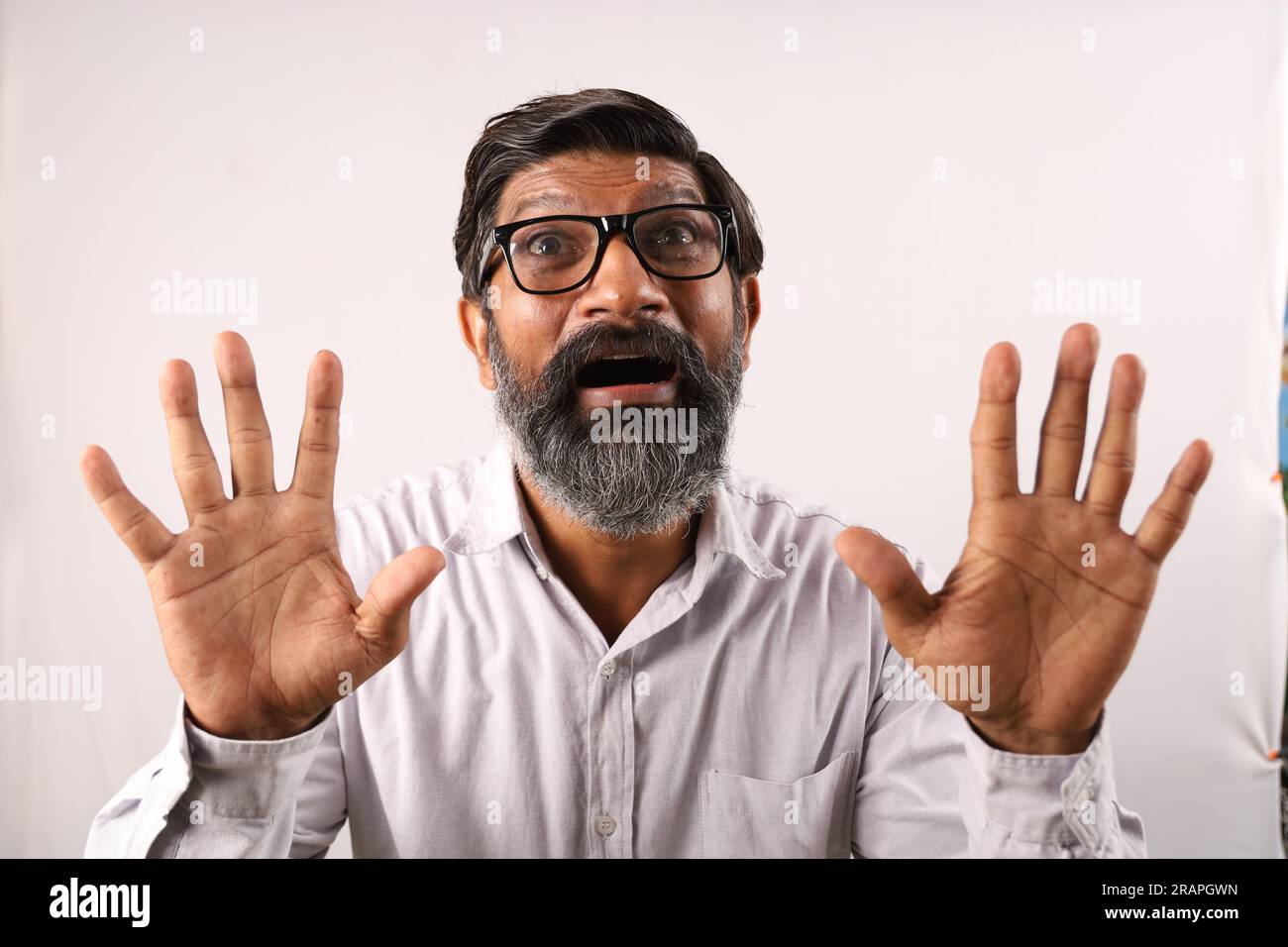 Portrait of Indian bearded man surprised. Funky expressions portraying ...