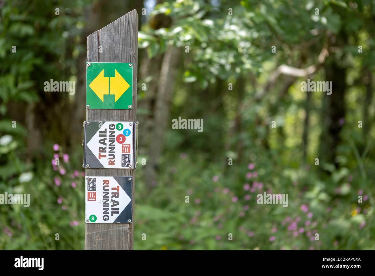 Trail and direction pole with arrows directing to various off road ...