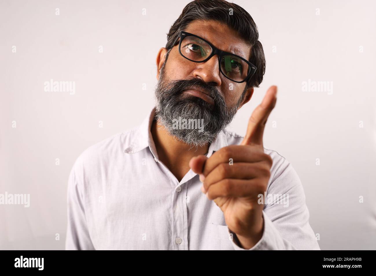 Angry man in beard and spectacles hi-res stock photography and images ...