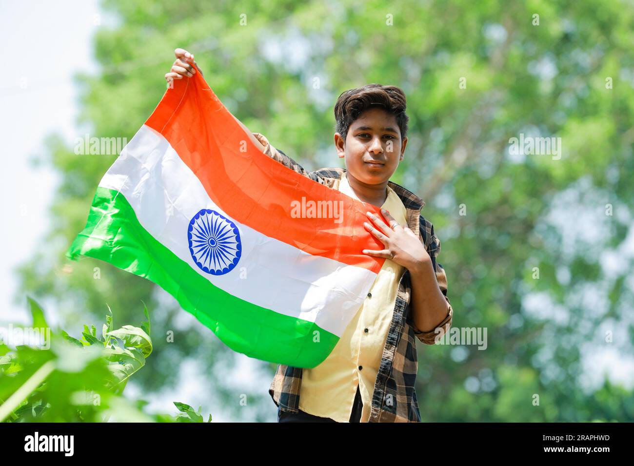 Indian boy holding national flag in farm, happy boy, national flag ...