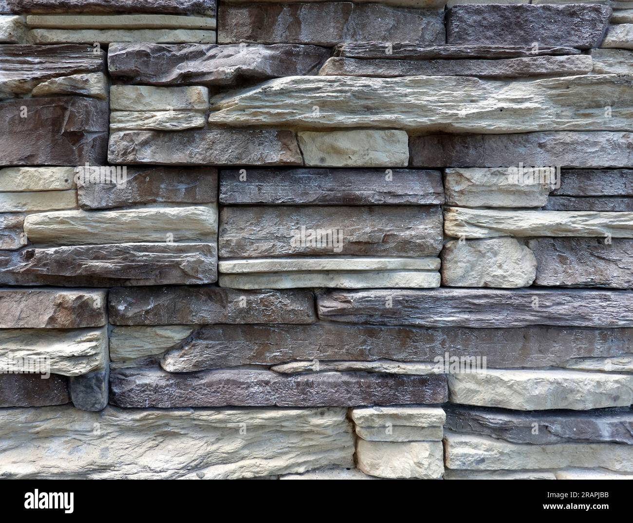 Wall stonework finishing from soft color natural stone trim as ...