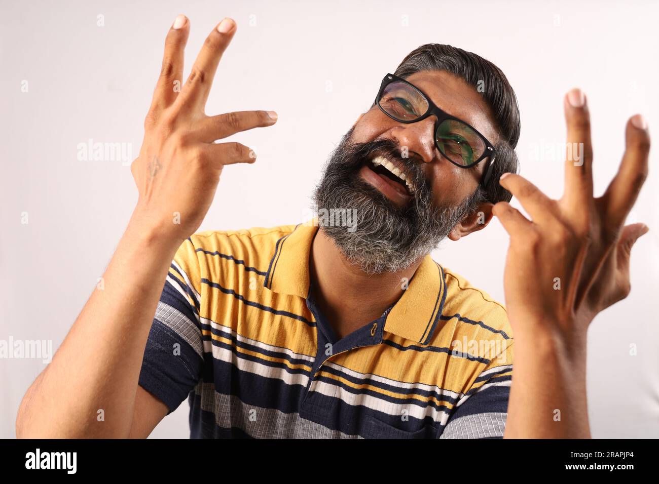 Portrait of an Indian bearded man wearing specs and t-shirt. Funky ...