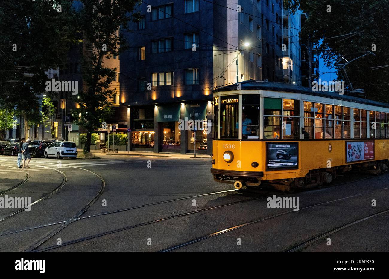 Traditional yellow tram in viale Monte Santo, Milano city center, by ...