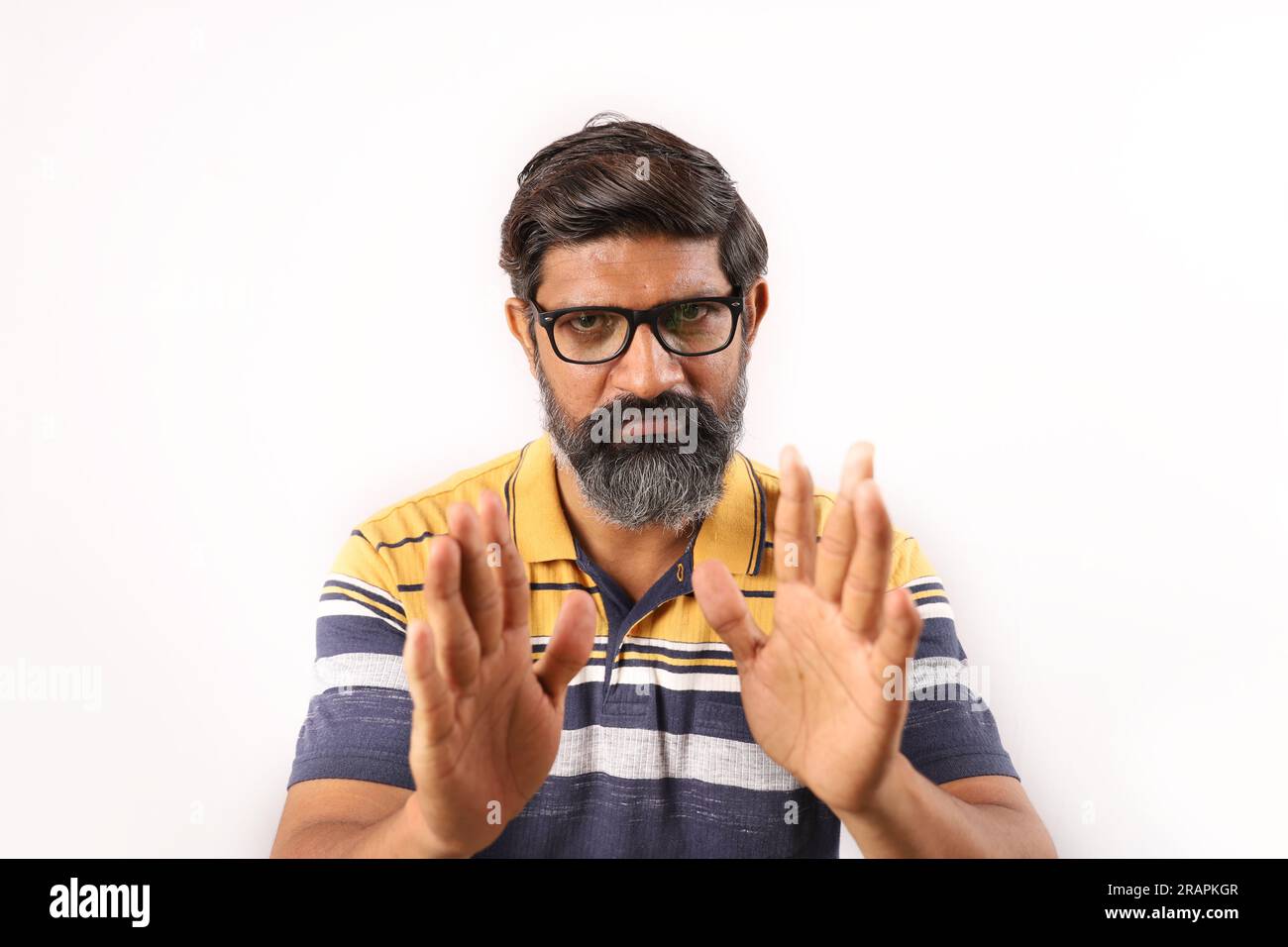 Portrait of an Indian bearded man wearing specs and t-shirt. Funky ...