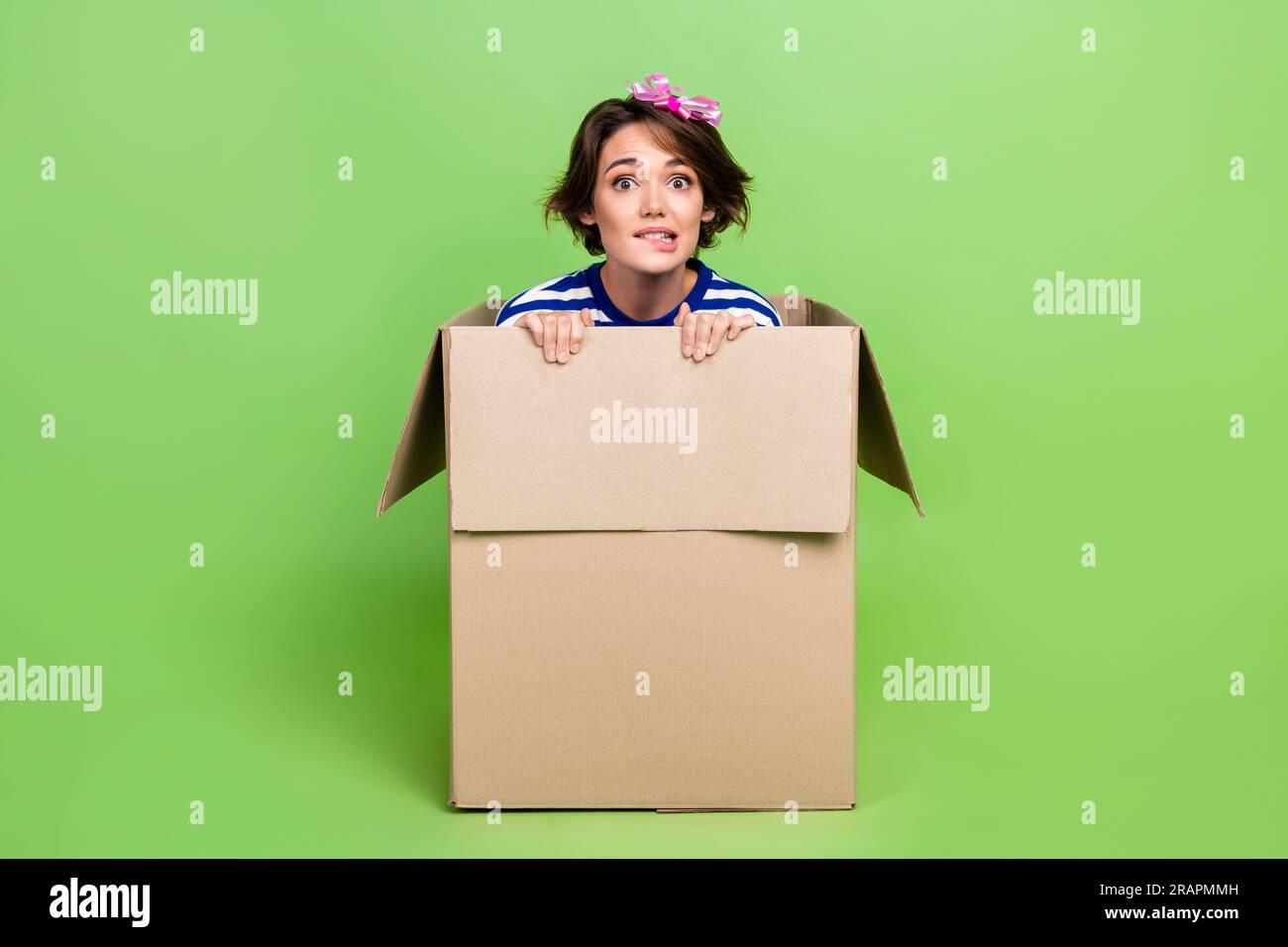 Full body photo of young funky girl bite lips sitting unwrapped carton ...