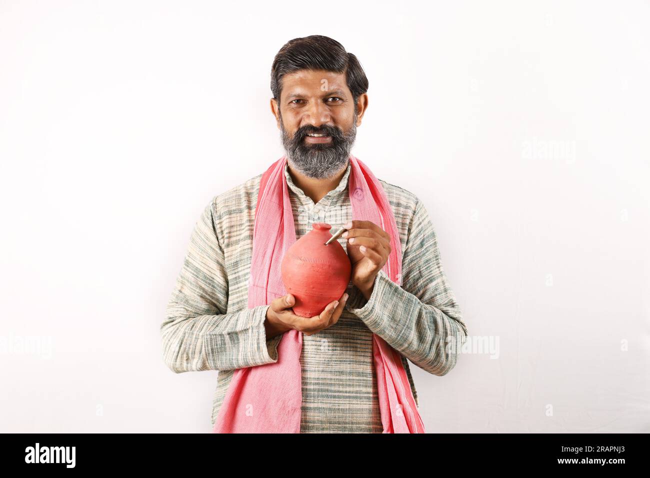 Portrait of happy Indian bearded farmer man in rural India concept ...