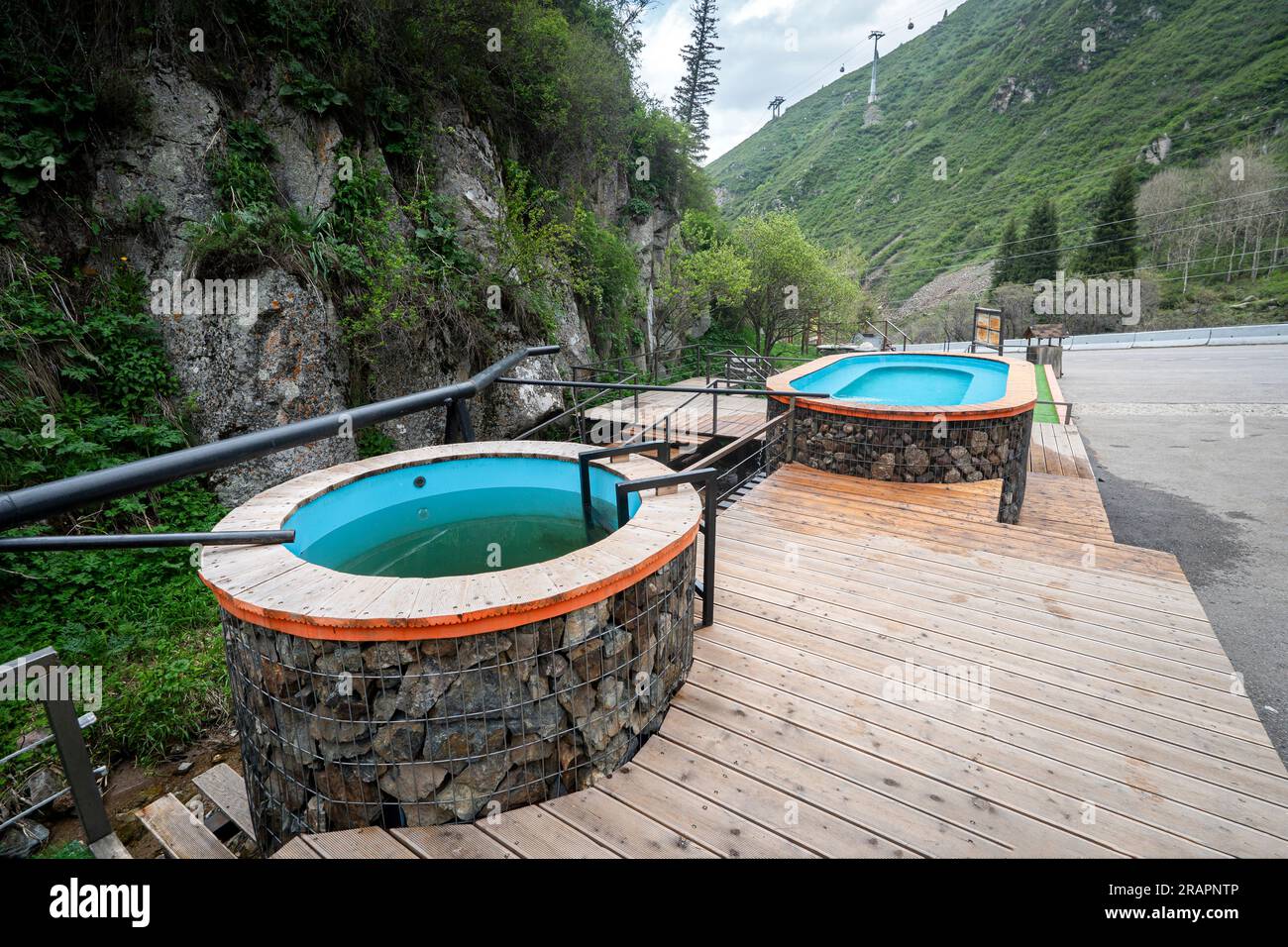 Hot springs geothermal water in mountains. Vat with hot geothermal ...