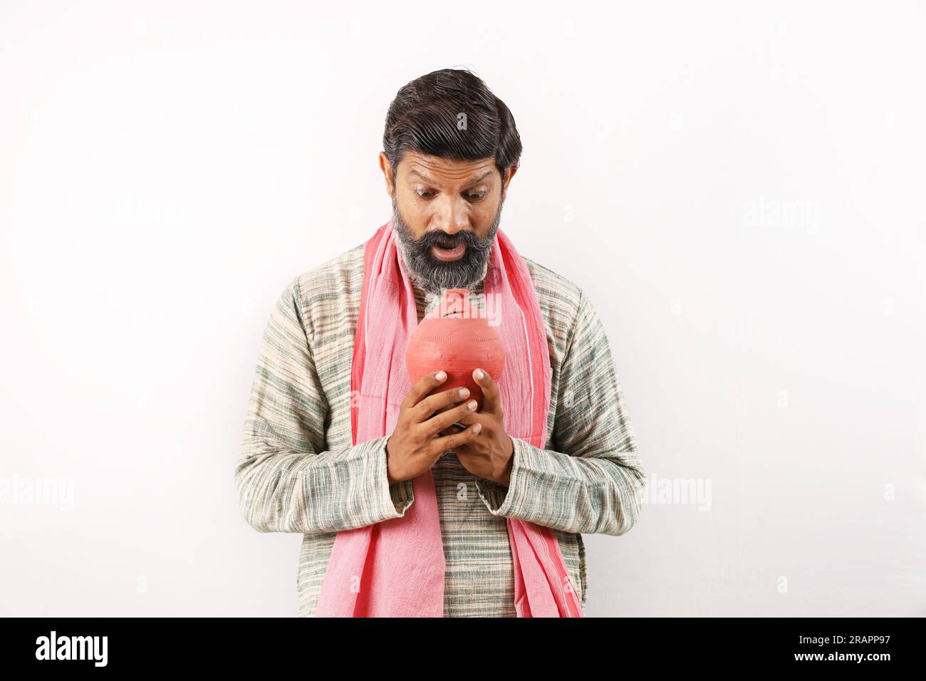 Portrait of happy Indian bearded farmer man in rural India concept ...
