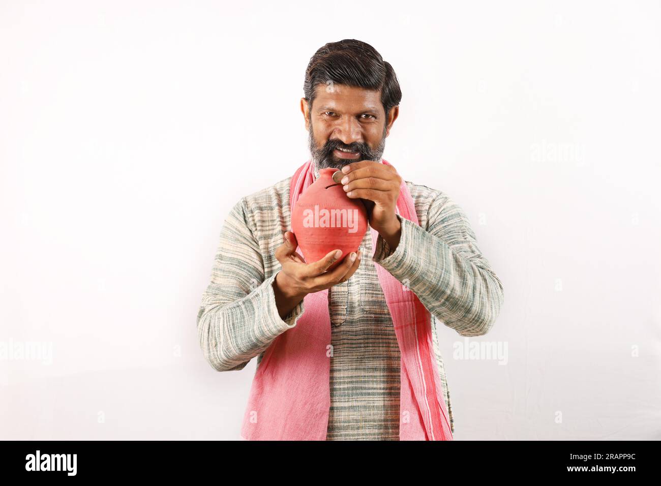 Portrait of happy Indian bearded farmer man in rural India concept ...
