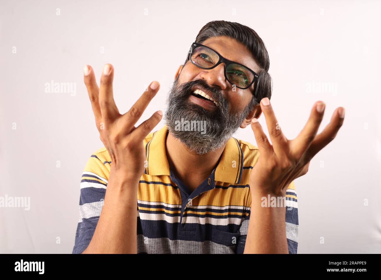 Portrait of an Indian bearded man wearing specs and t-shirt. Funky ...