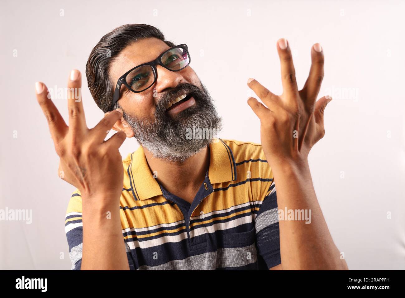 Portrait of an Indian bearded man wearing specs and t-shirt. Funky ...