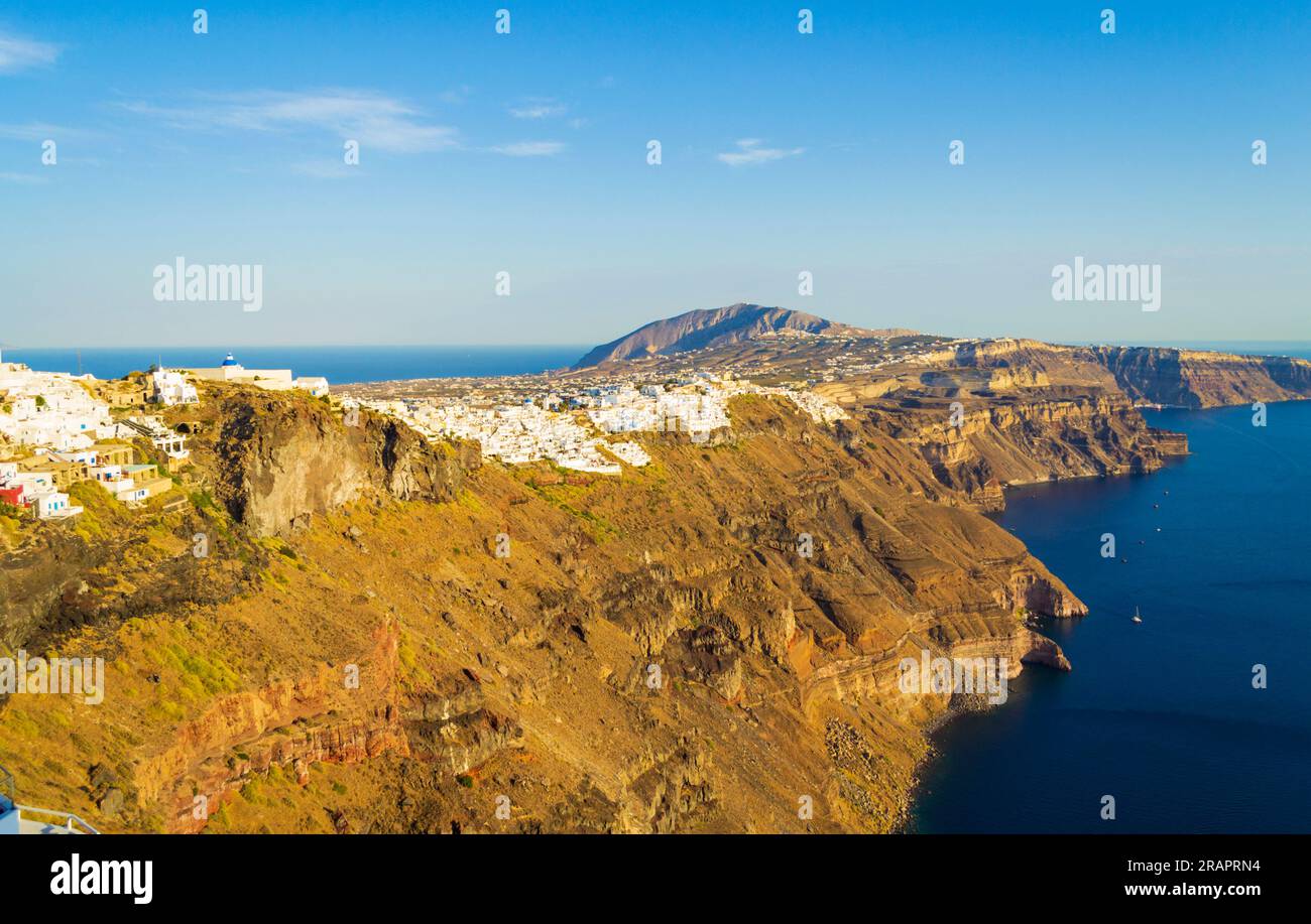 Scenic view of Santorini Caldera cliff face with traditional white ...