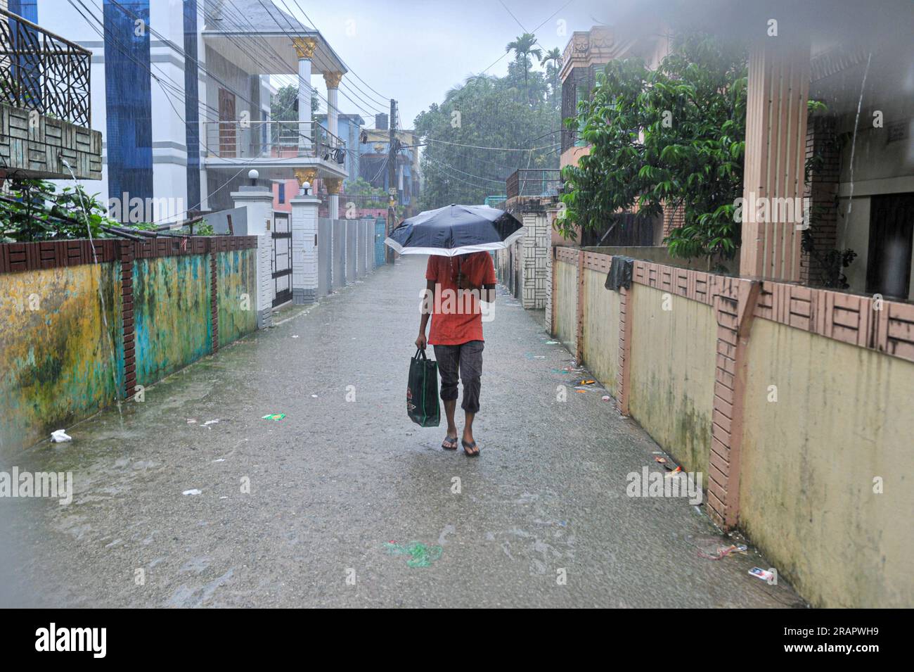 People make their way during heavy rainfall. Incessant rains for the ...