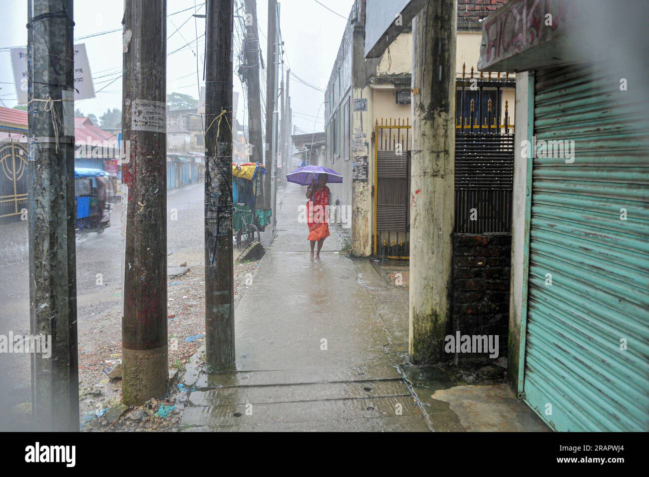 People make their way during heavy rainfall. Incessant rains for the ...