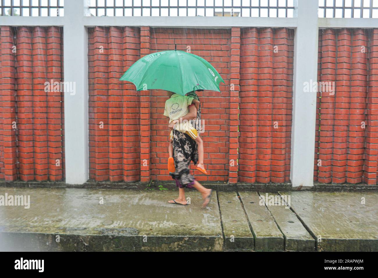People make their way during heavy rainfall. Incessant rains for the ...