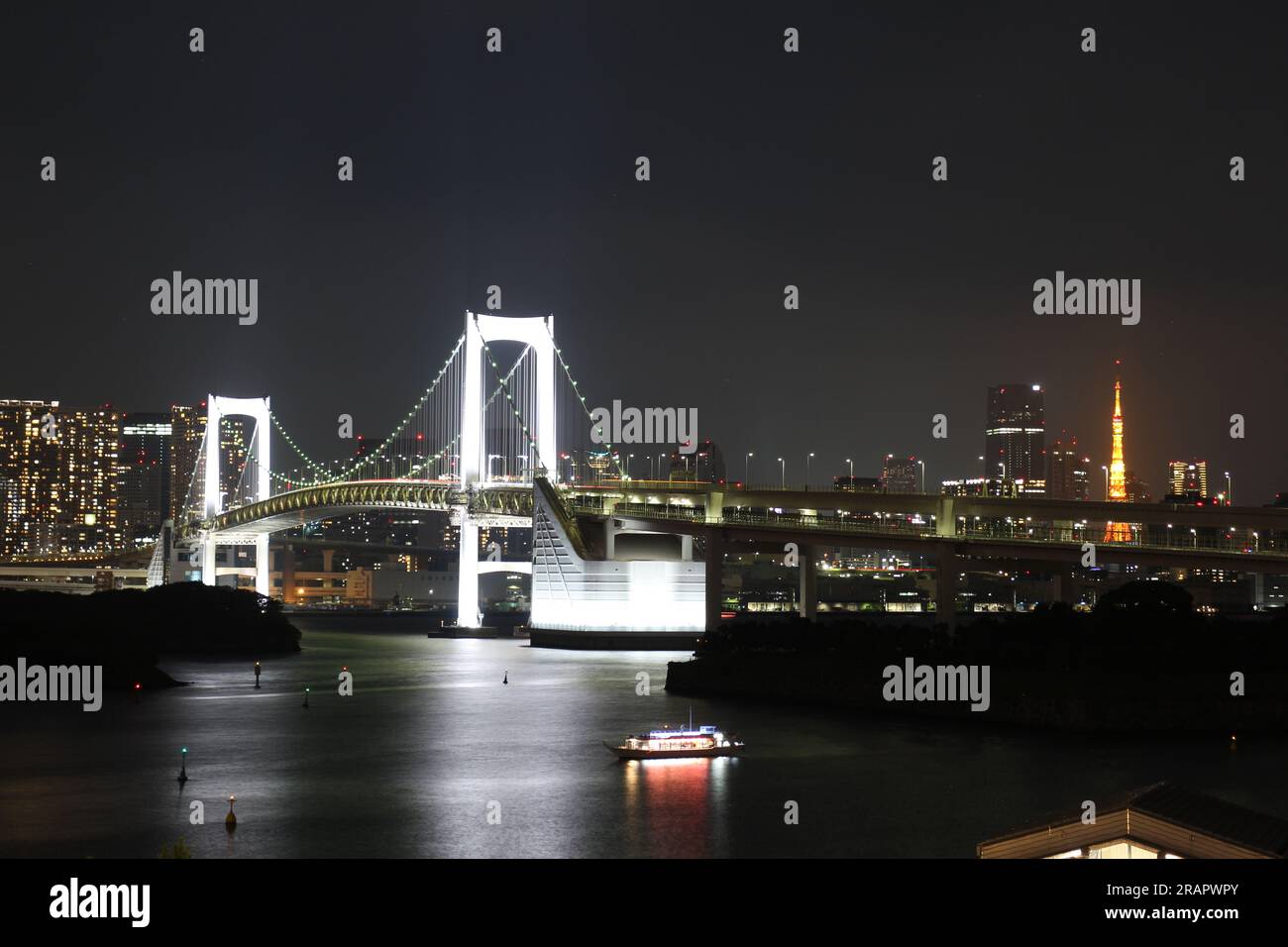Night view of Odaiba Seaside Park and Rainbow Bridge in Tokyo, Japan ...
